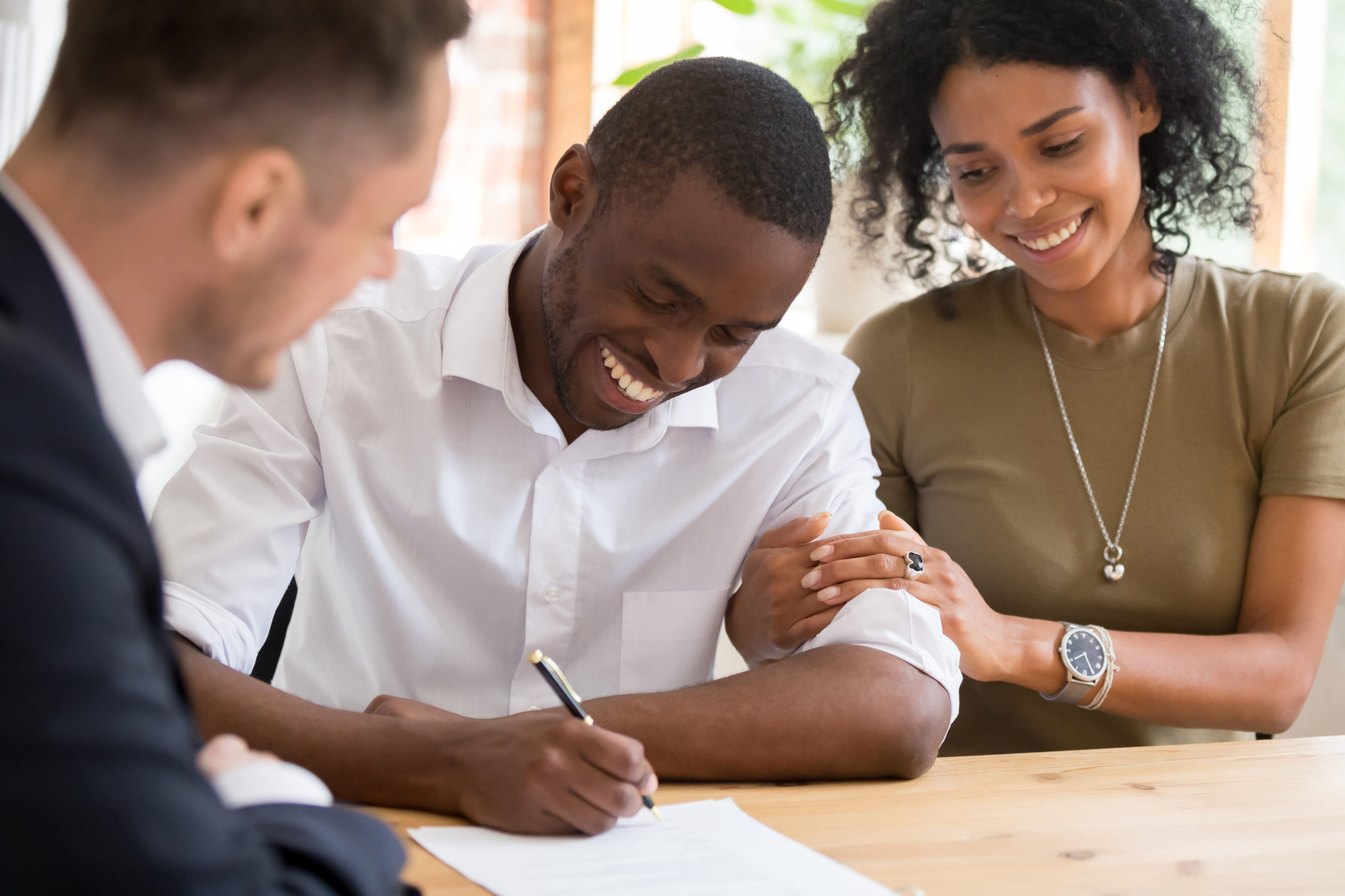 Couple Signing Paperwork - Disability Professionals Site